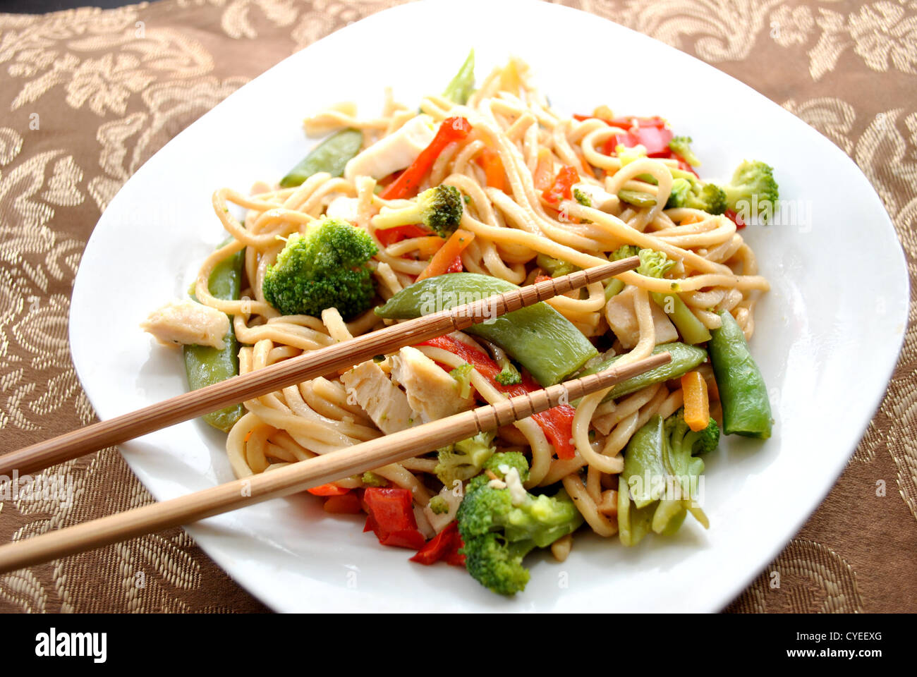 Chop Sticks on Chicken Lo Mein Stock Photo - Alamy