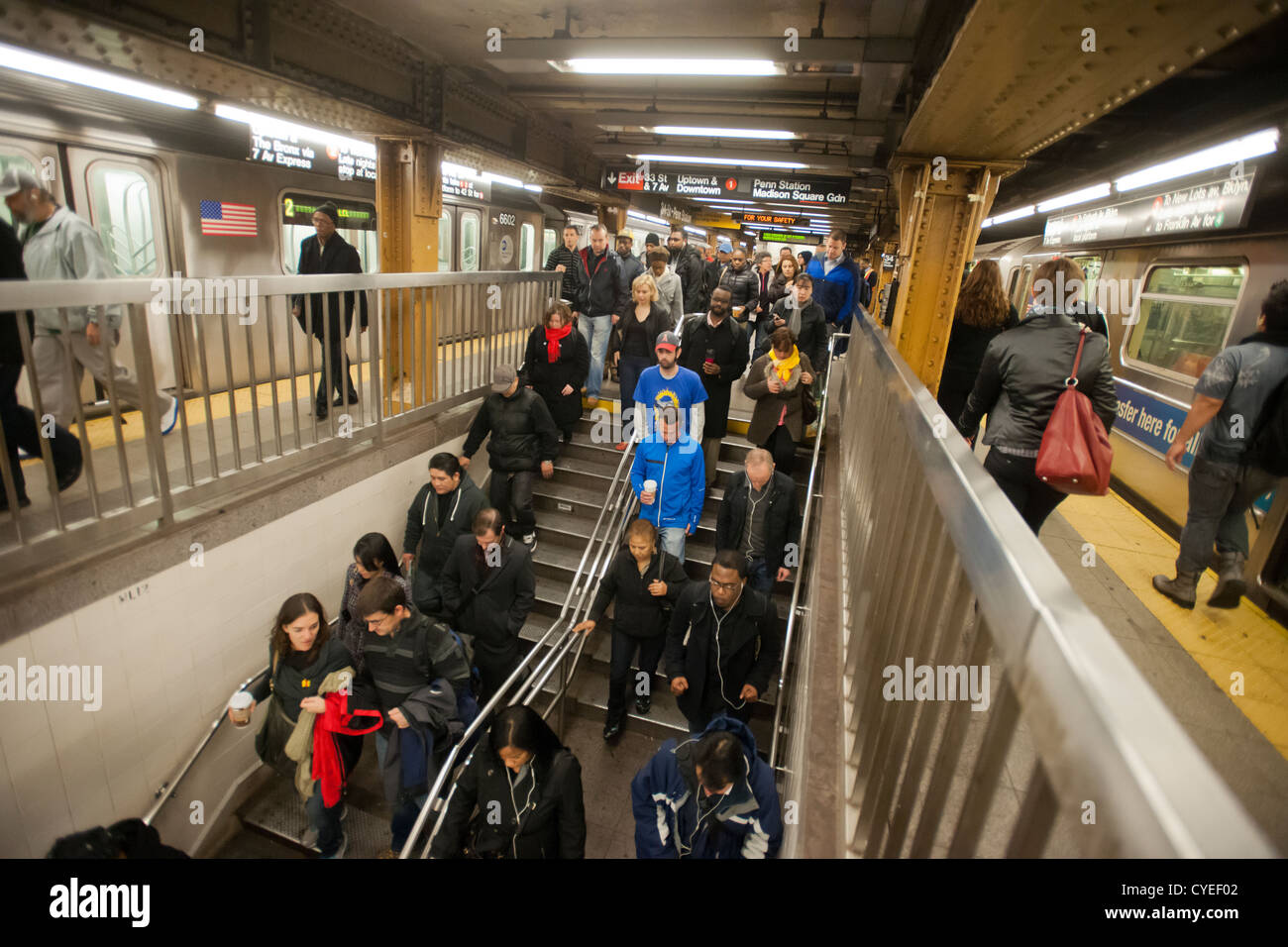 Commuters in New York arrive at Penn Station on the IRT subway line ...