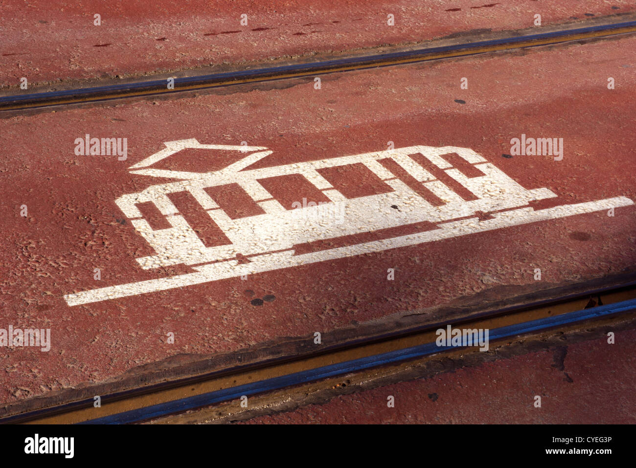 Tram signal painted on the pavement between two rails Stock Photo - Alamy