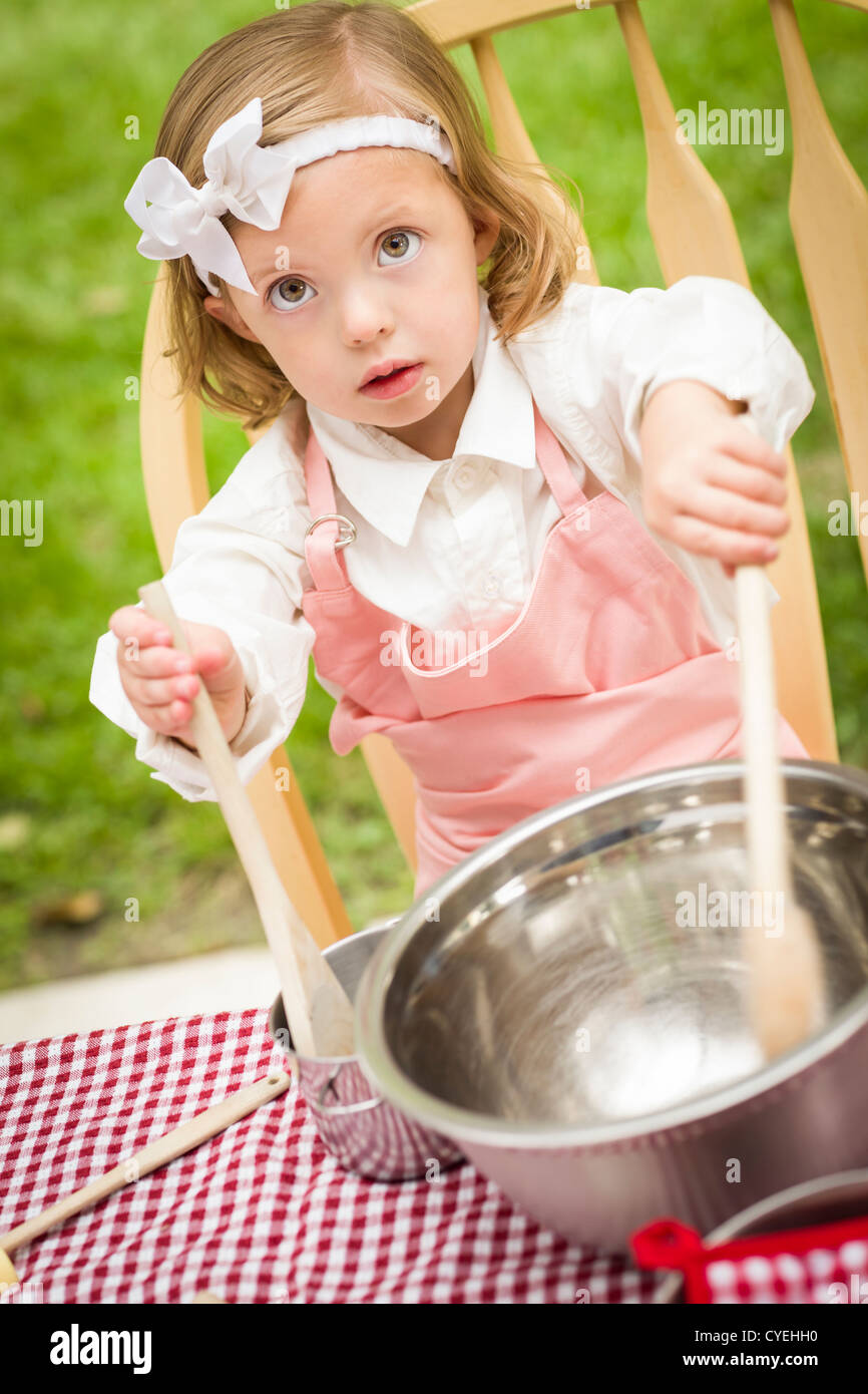 Happy Adorable Little Girl Playing Chef Cooking in Her Pink Outfit ...