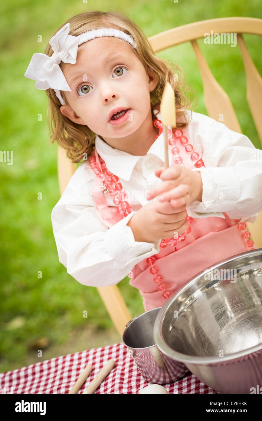 Happy Adorable Little Girl Playing Chef Cooking in Her Pink Outfit ...