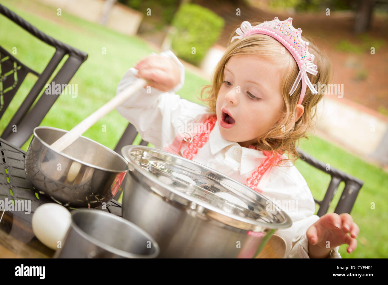 Happy Adorable Little Girl Playing Chef Cooking in Her Pink Outfit ...