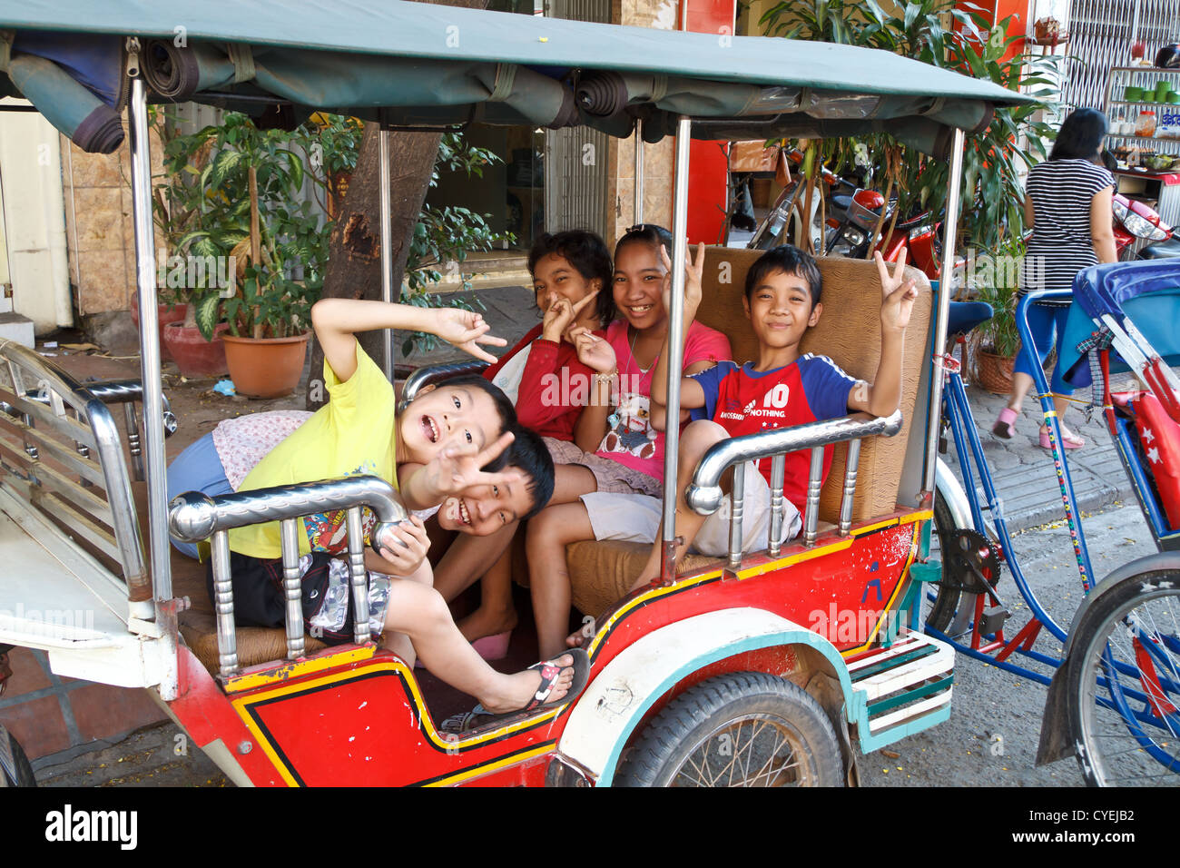 Children in a Tuk-Tuk in Phnom Penh, Cambodia Stock Photo - Alamy