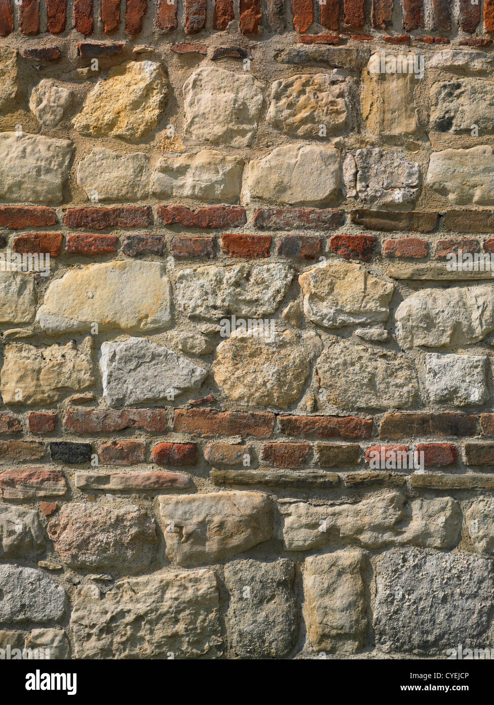 Wall of bricks and rocks, wide and detail Stock Photo - Alamy