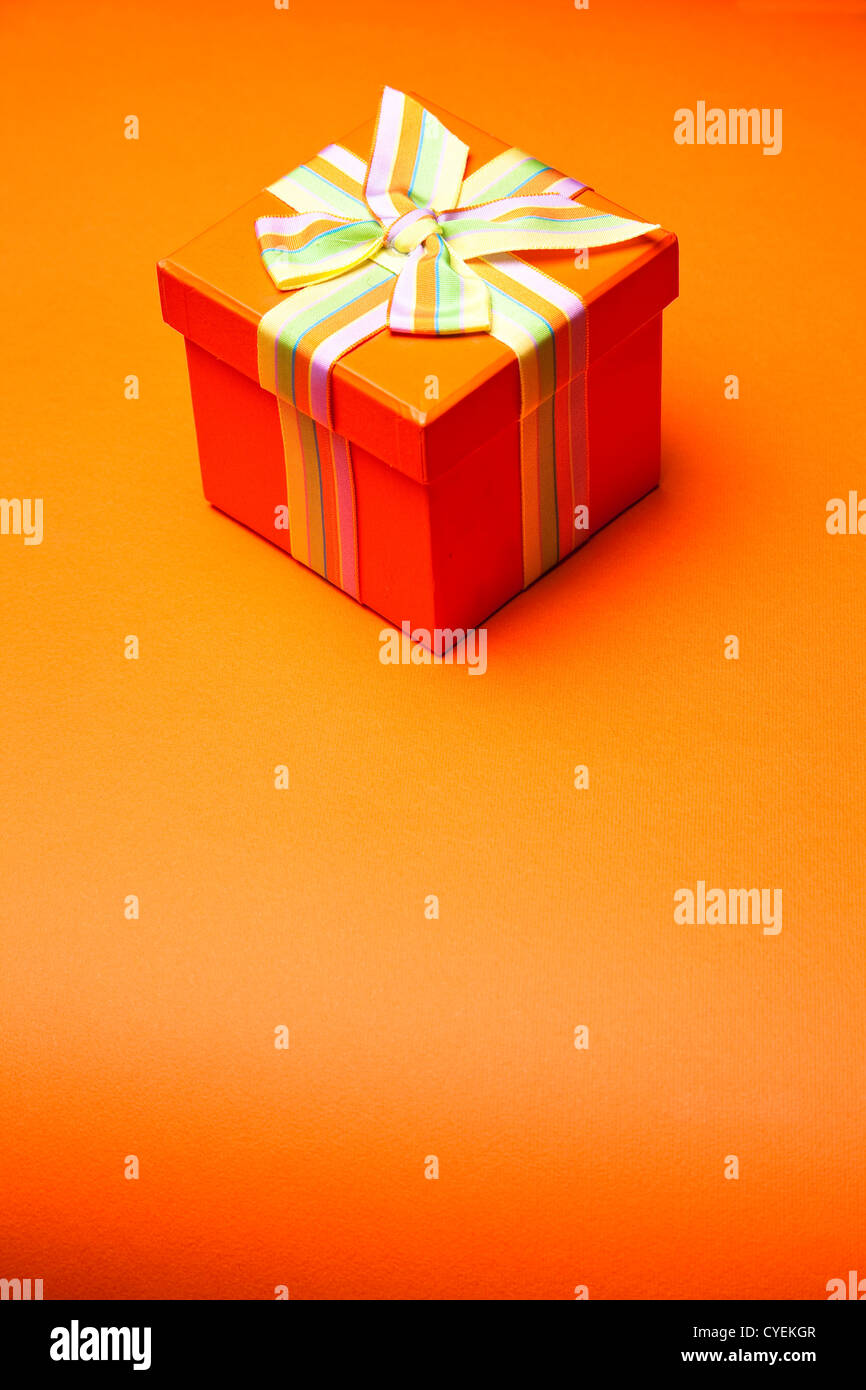 Concept and ideas: Gift Box On Orange Background Stock Photo - Alamy
