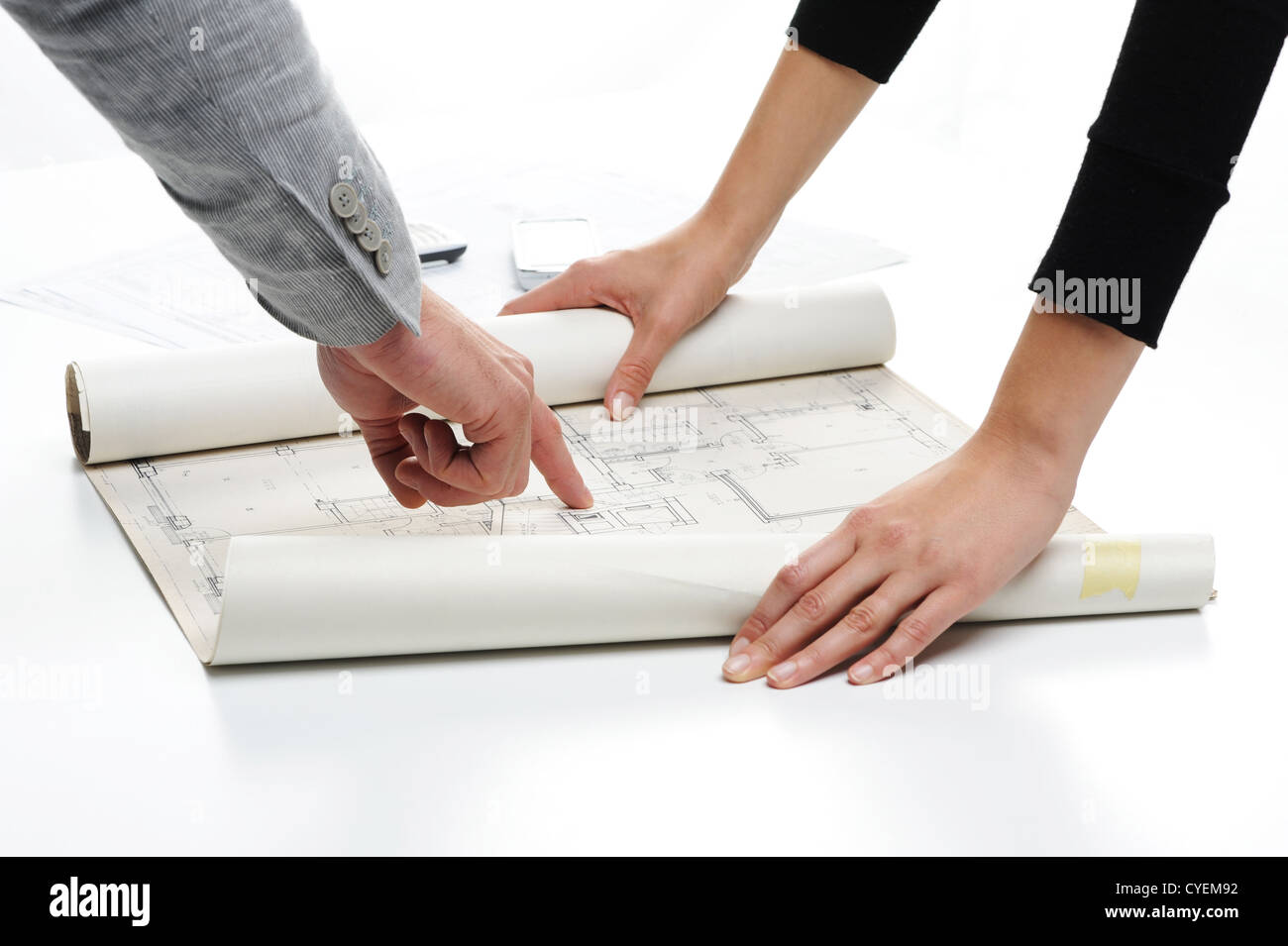 Architect´┐¢s hands pointing on the blueprint of new house project ...