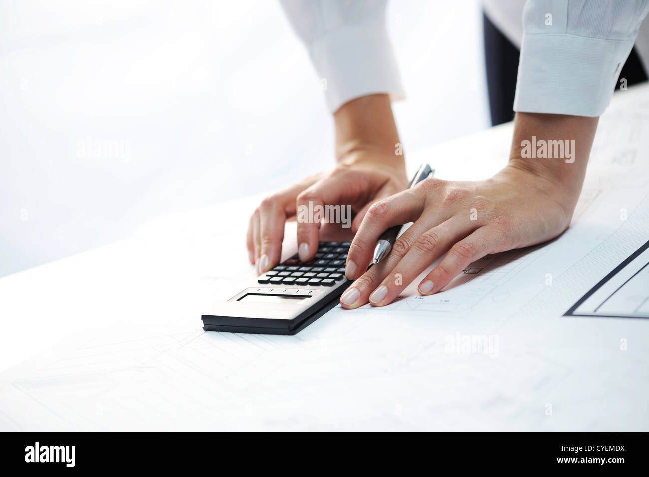 woman's hands with a calculator Stock Photo - Alamy