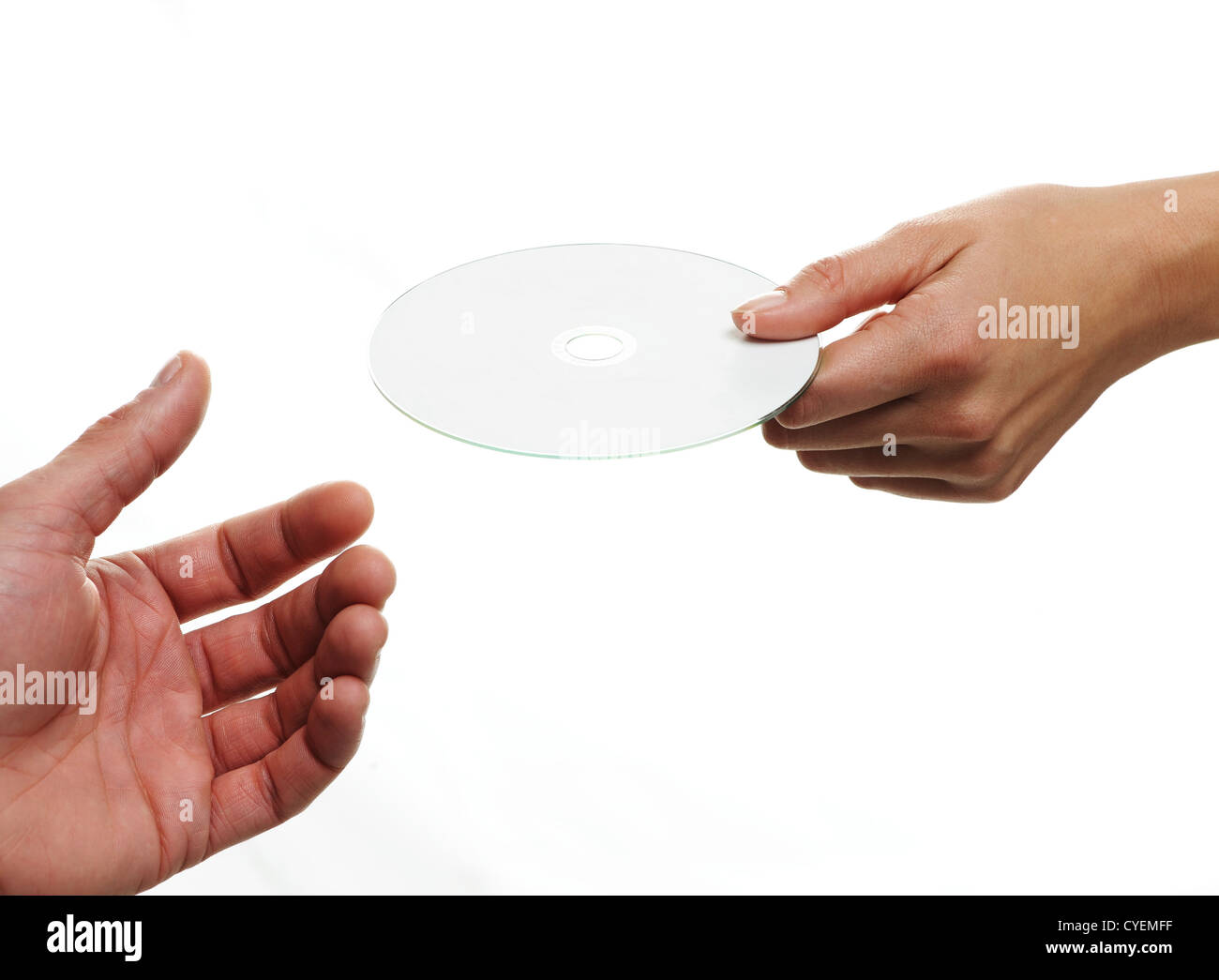 Female hand holding a blank disc, white background Stock Photo - Alamy