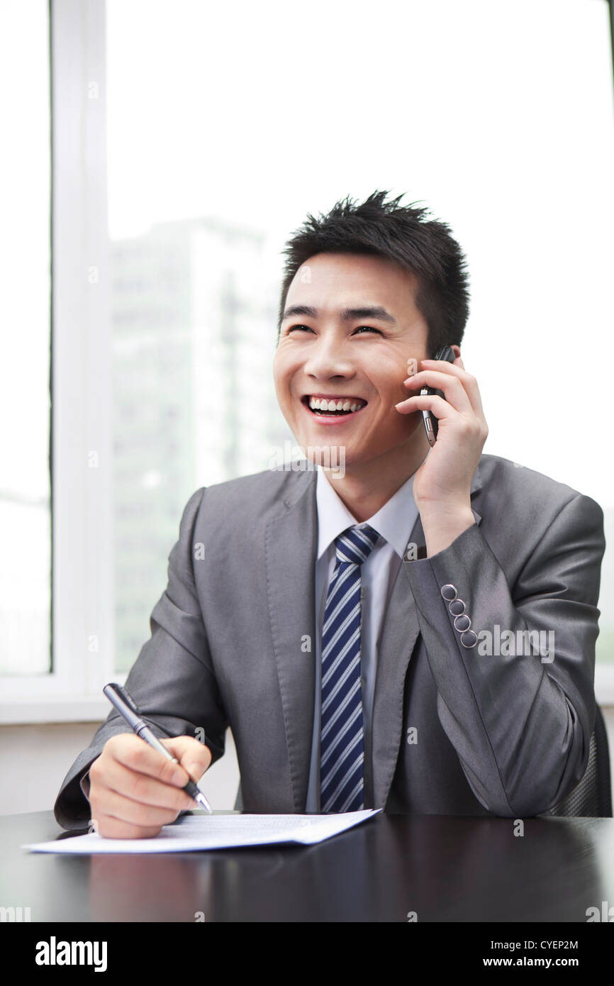 Businessman using mobile phone Stock Photo - Alamy Businessman using mobile phone Stock Photo - Alamy