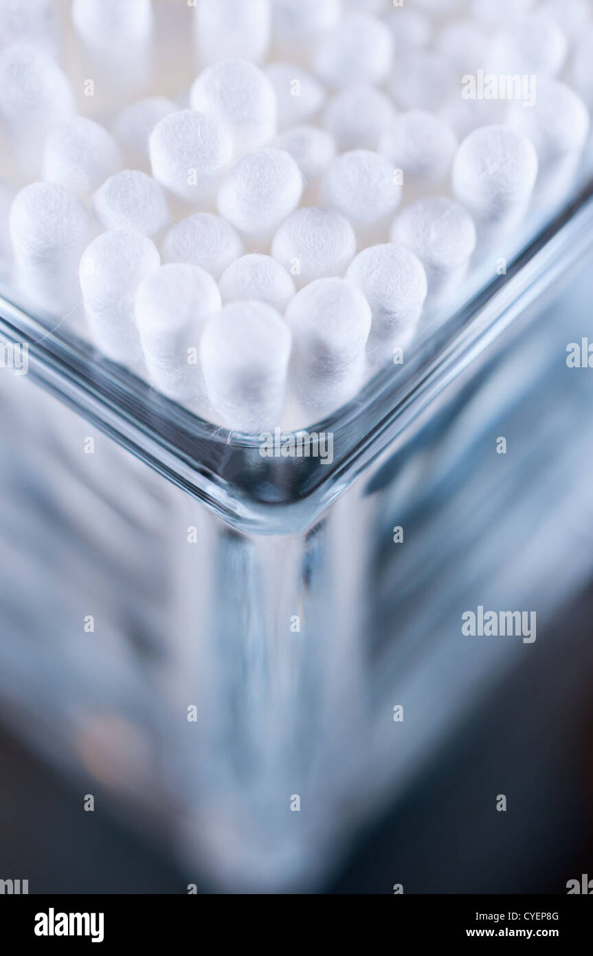 Cotton buds in a glass corner close up Stock Photo - Alamy