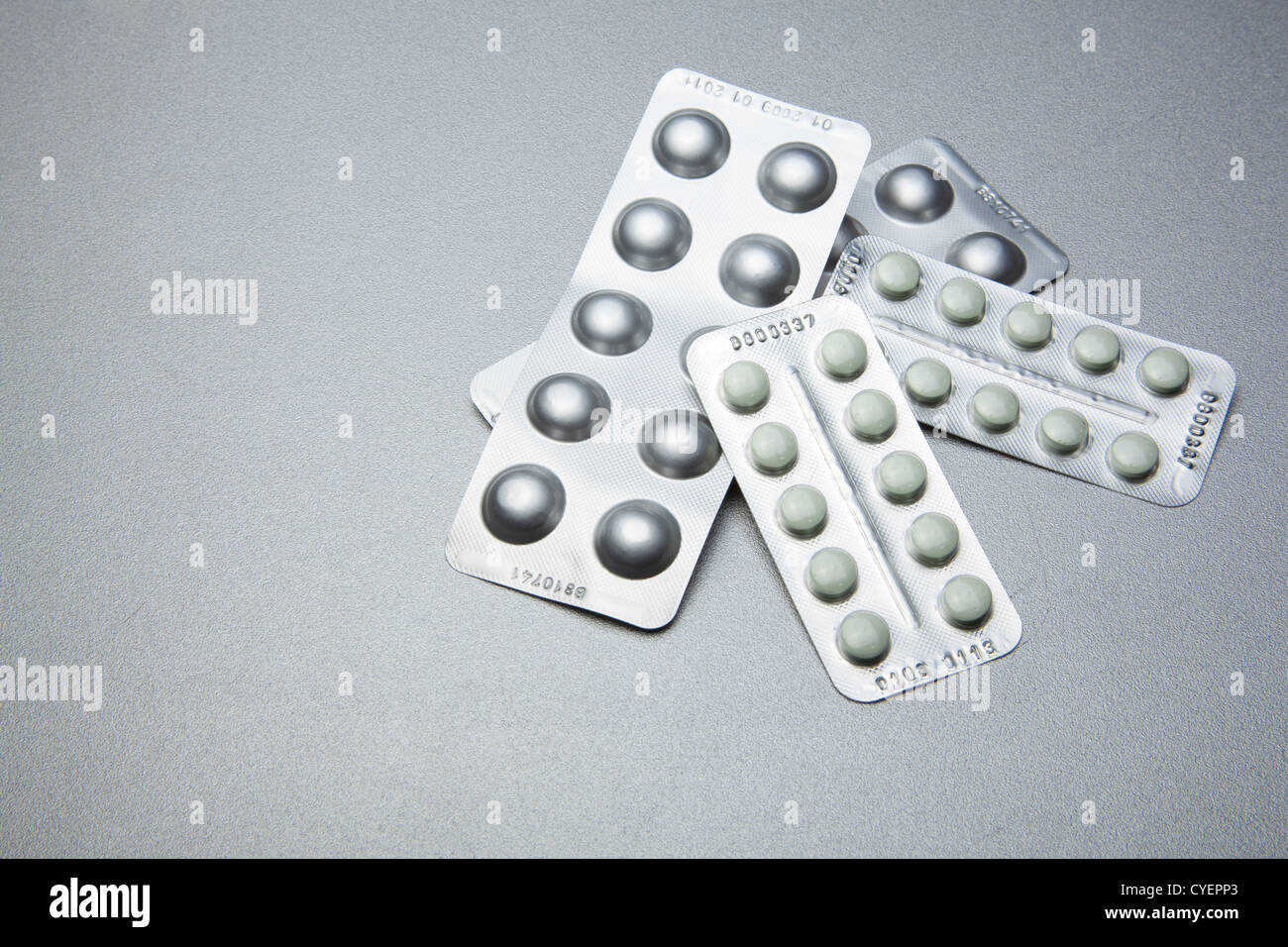 Silver Pills On Metal Table Background, copy space Stock Photo - Alamy