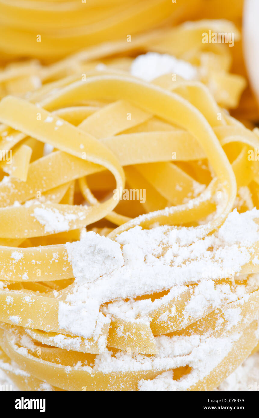 Italian pasta and flour close up Stock Photo - Alamy