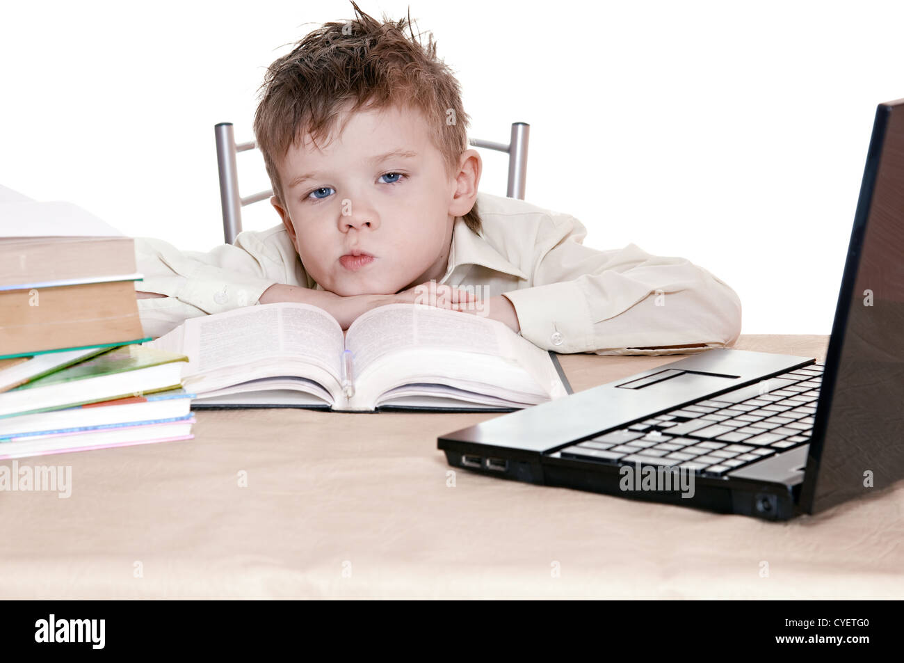 boy pupil thinks for in time homework Stock Photo - Alamy