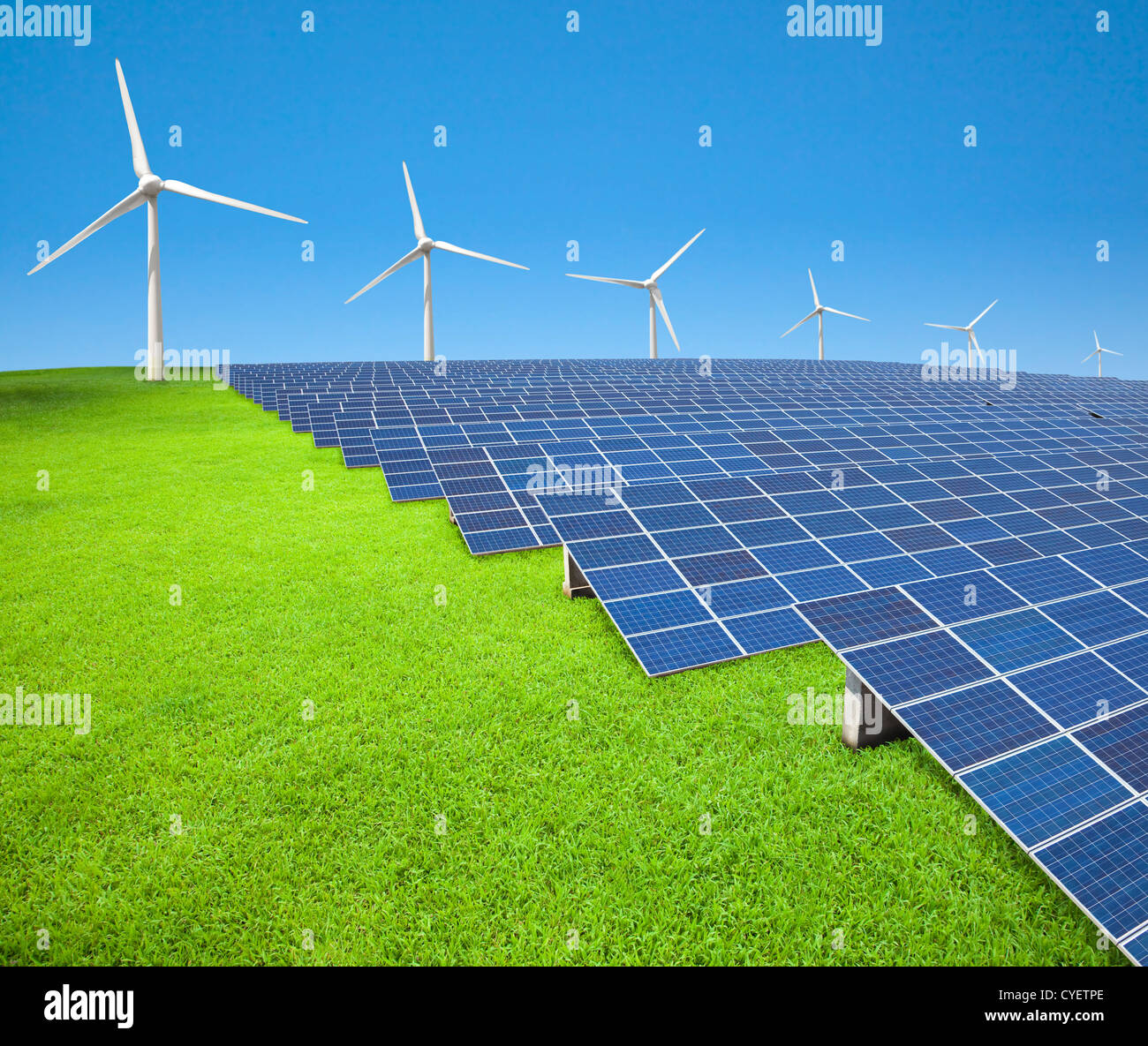 solar panels and wind turbines on the grass field Stock Photo - Alamy