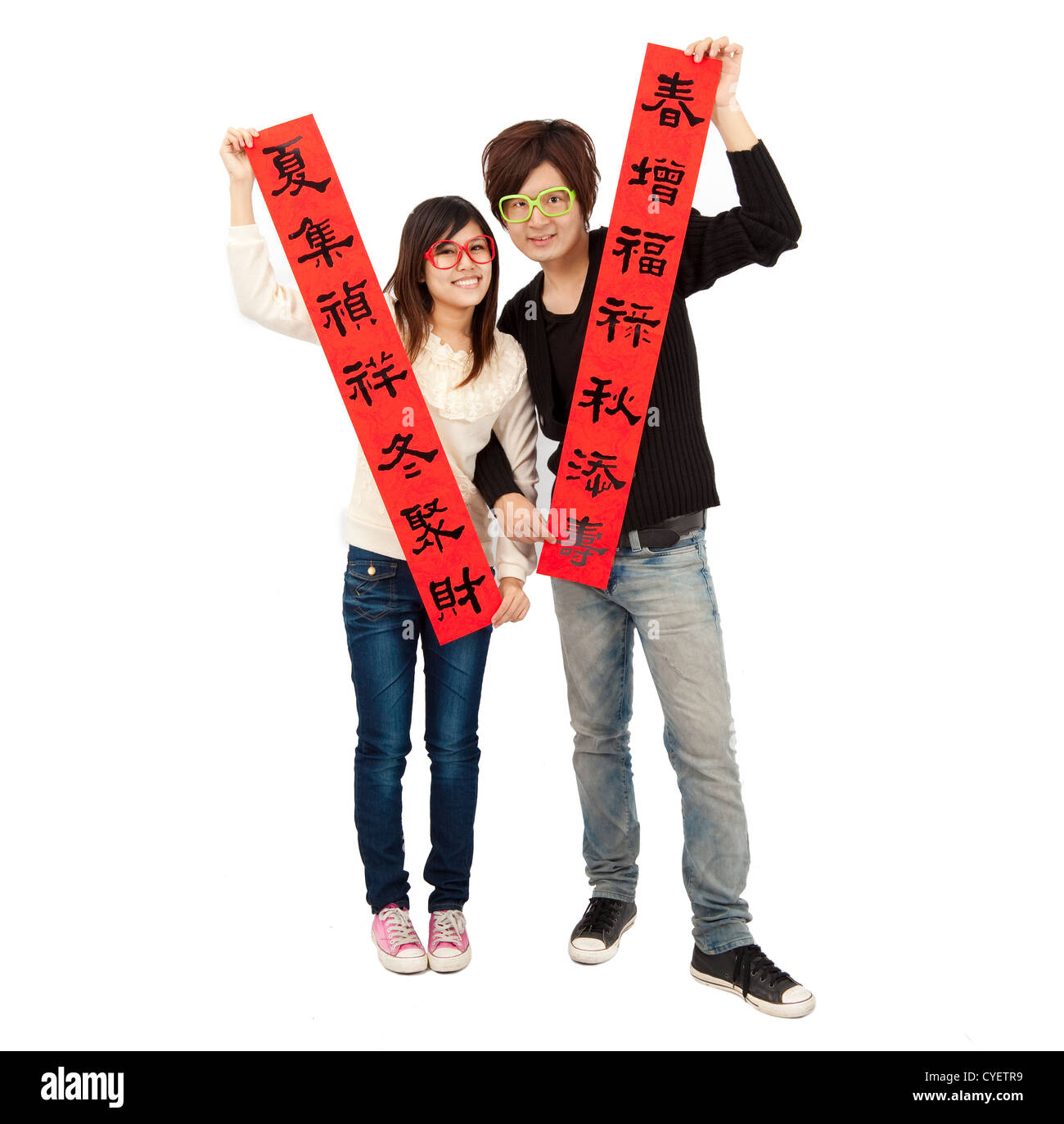 Happy chinese new year. Young couple holding red spring couplets for ...