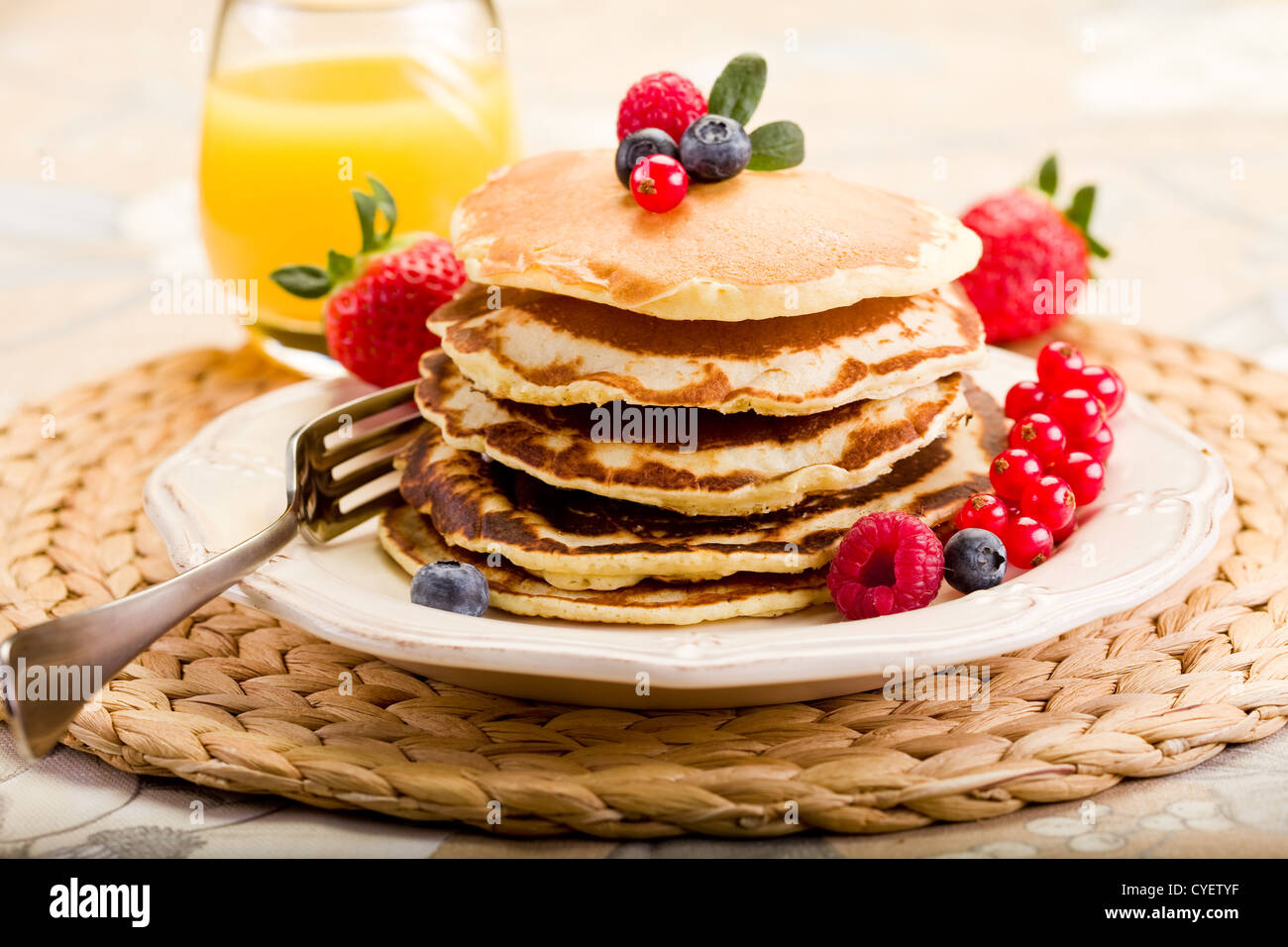 delicious pancakes on morning breakfast table with fruits Stock Photo ...