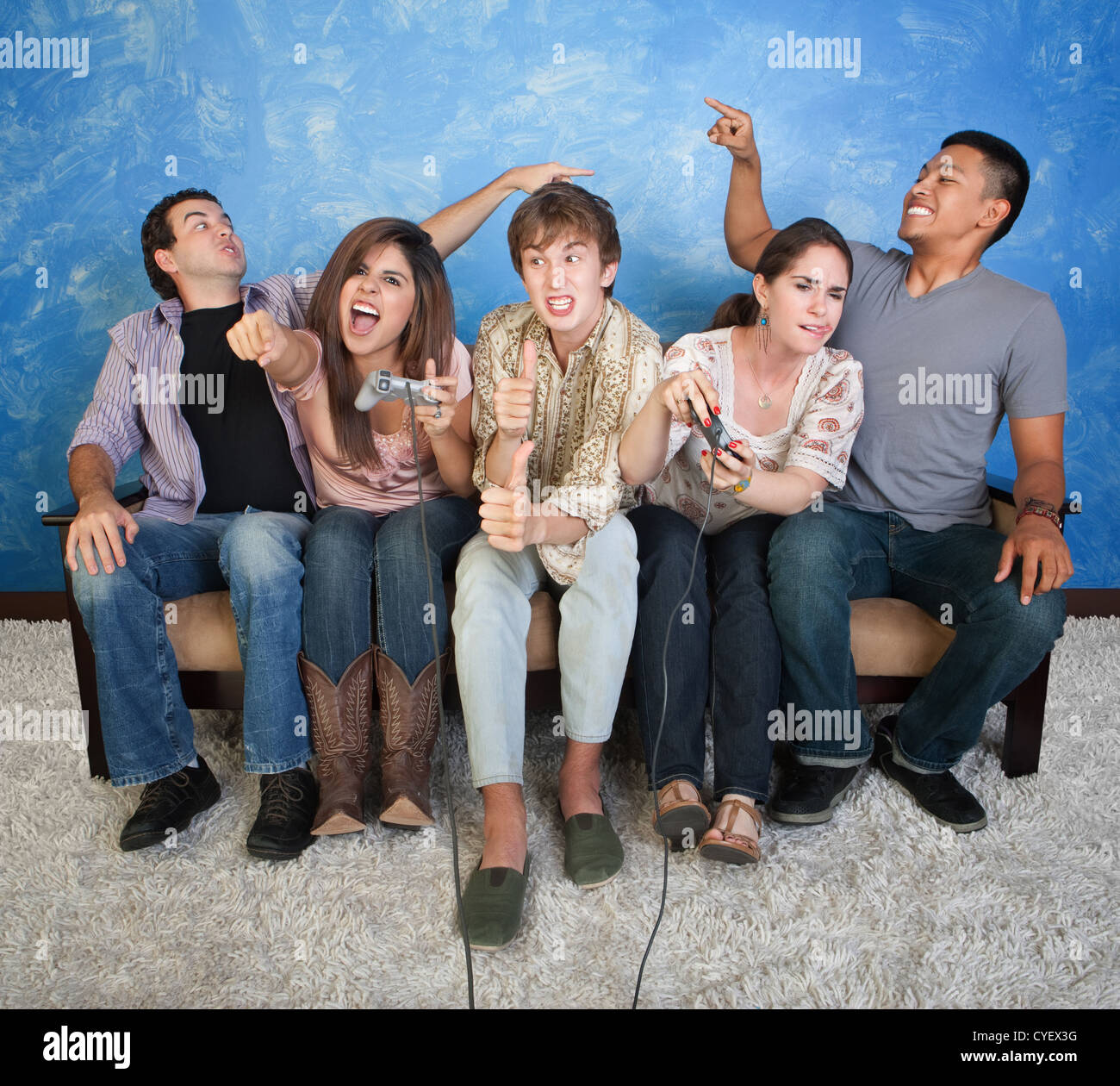 Diverse group friends playing video hi-res stock photography and images ...