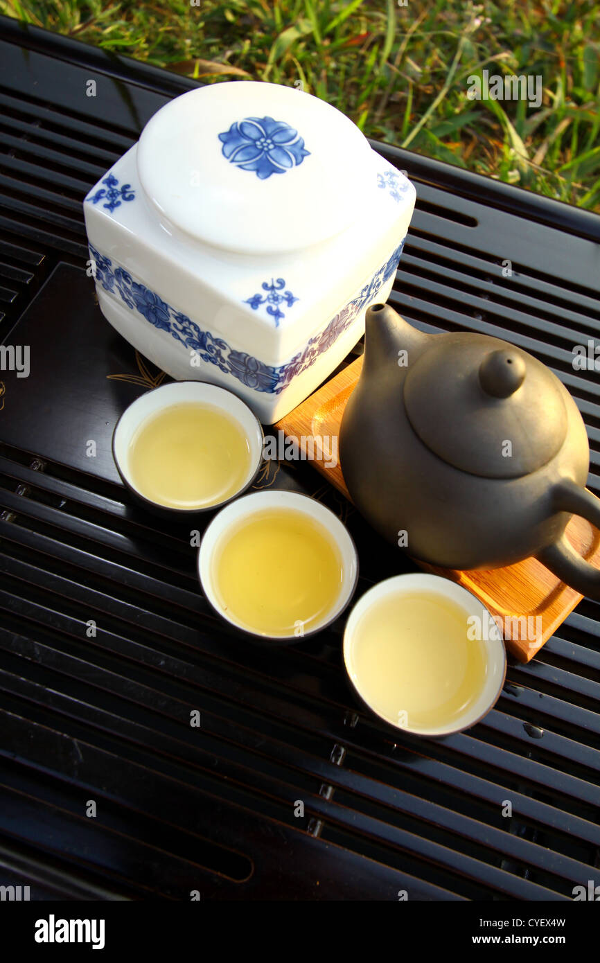 Chinese tea set under sunlight Stock Photo - Alamy