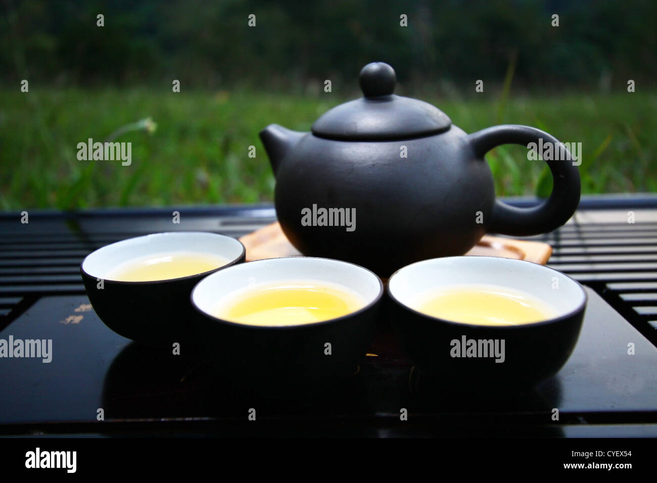 Chinese tea set on grasses Stock Photo - Alamy