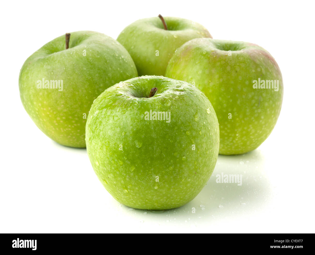 Four ripe green apples. Isolated on white Stock Photo - Alamy