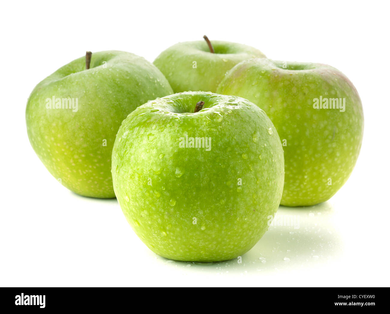 Four ripe green apples. Isolated on white Stock Photo - Alamy