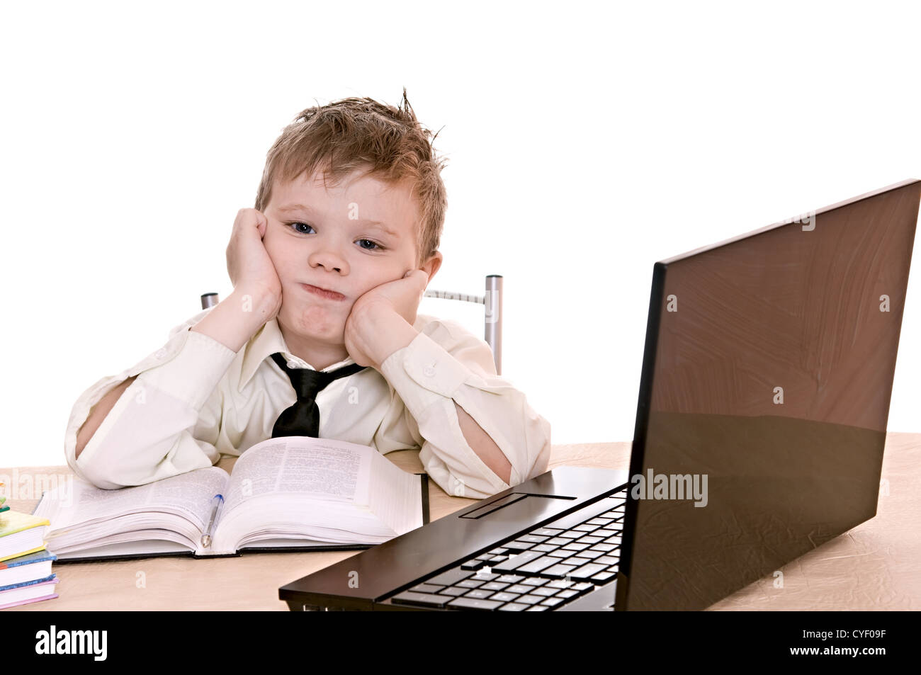 boy pupil thinks for in time homework Stock Photo - Alamy