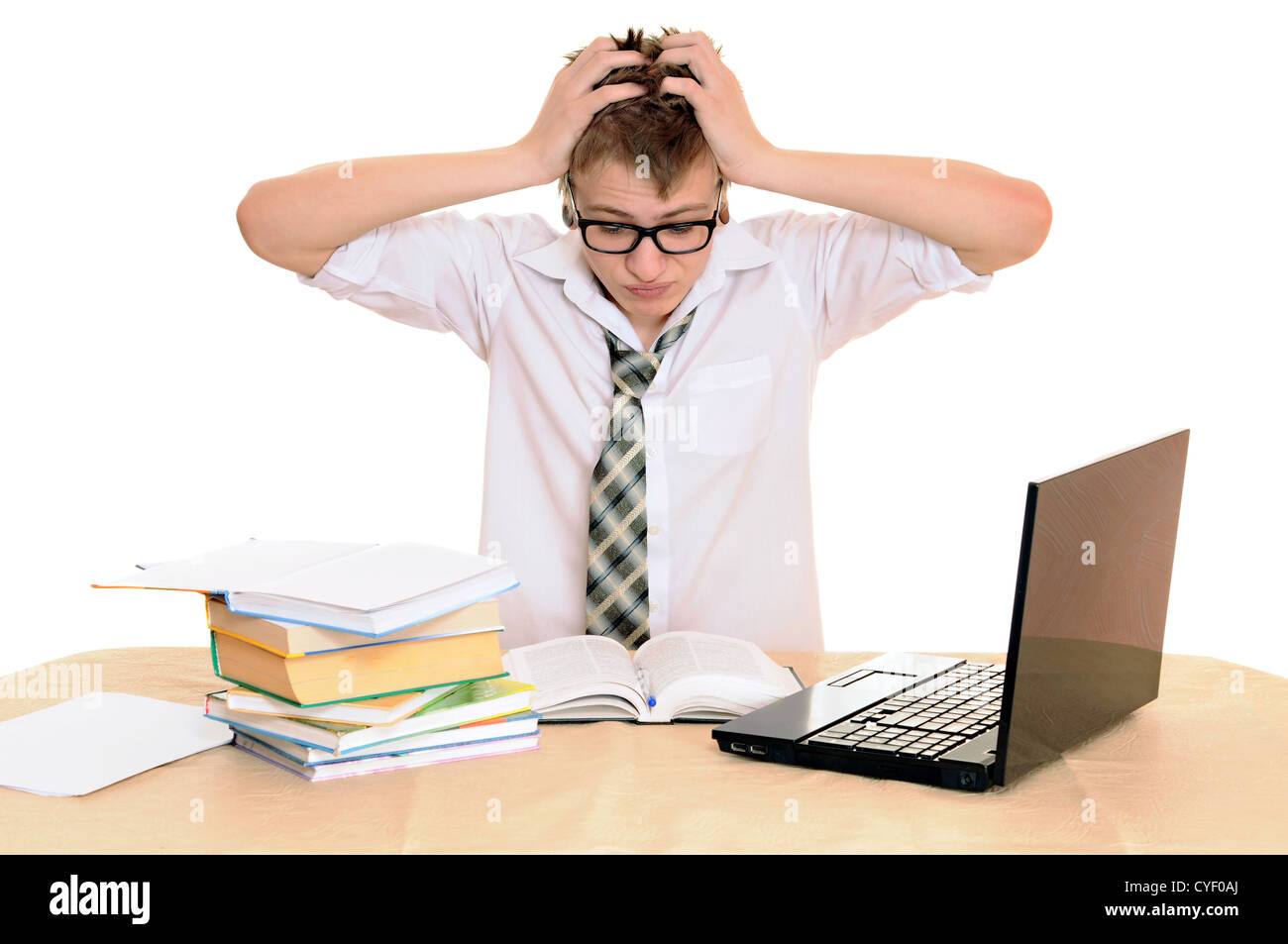 teenager student sits behind a desk isolated on white background Stock ...
