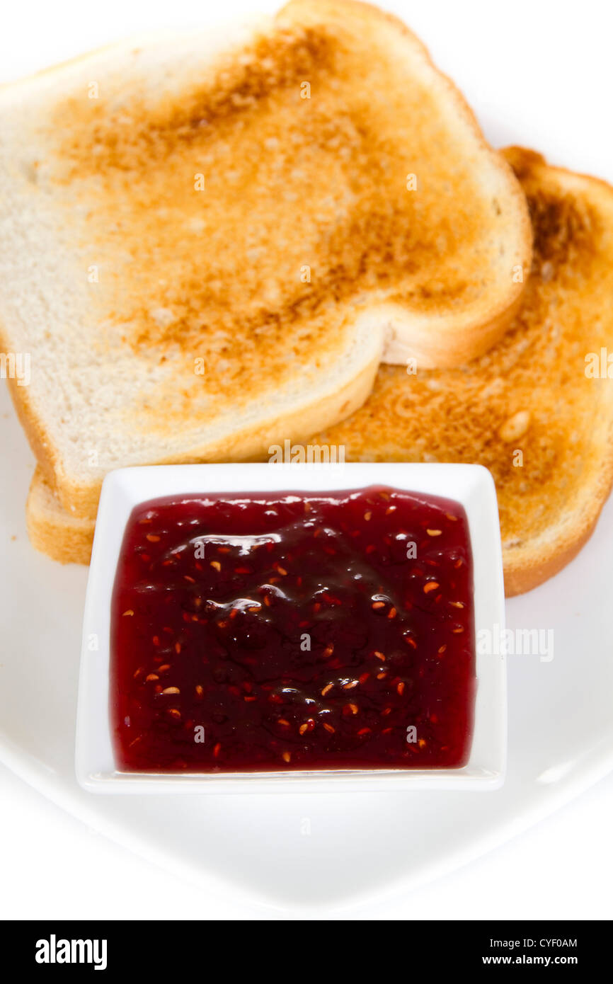 Toasts with jam over white background Stock Photo - Alamy