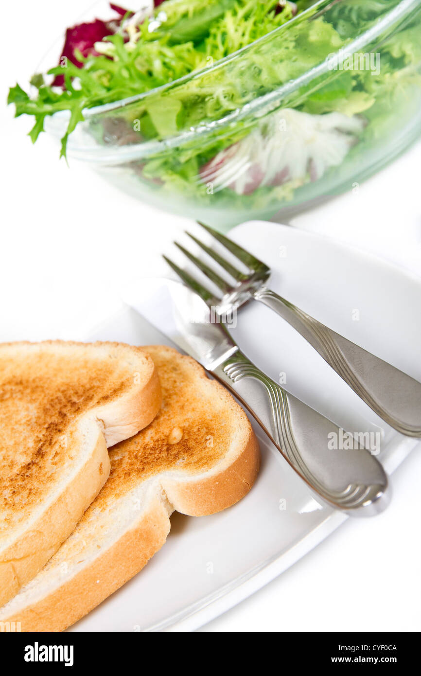 Two toasts and bowl of salad isolated over white background Stock Photo ...