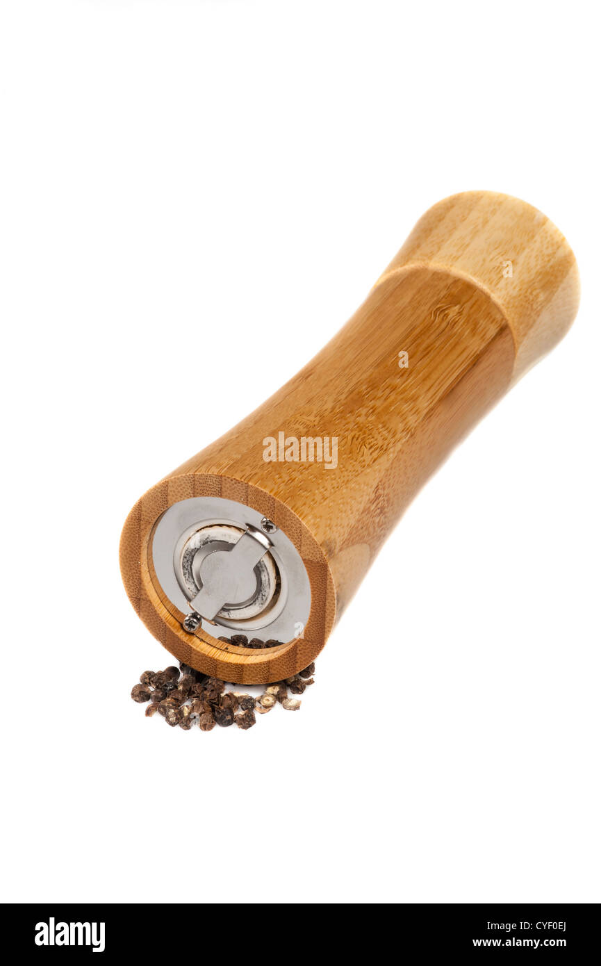 isolated bamboo pepper grinder with grains on white background Stock ...