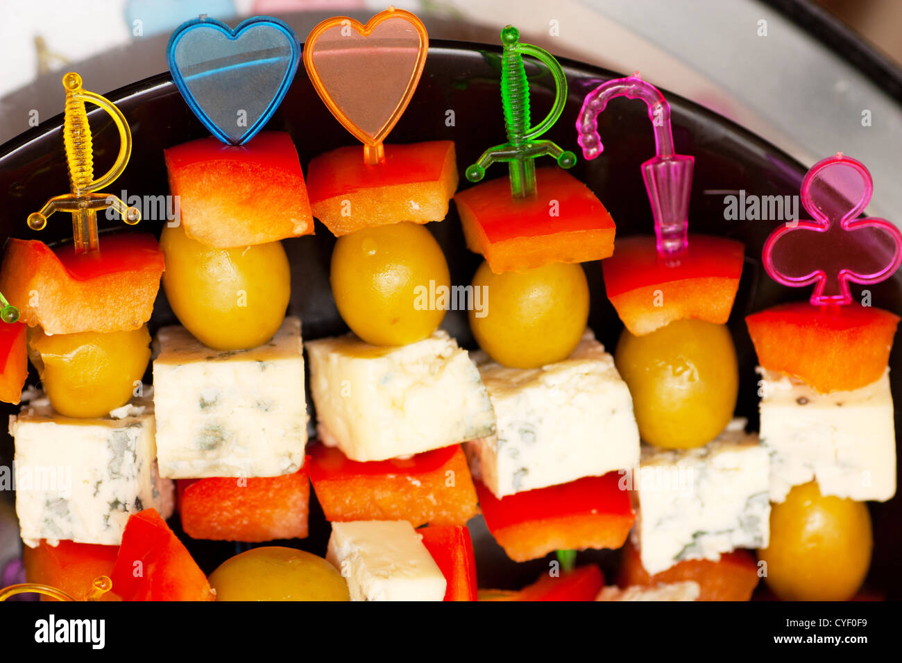 Closeup view of cocktail sticks with olive and cheese Stock Photo - Alamy