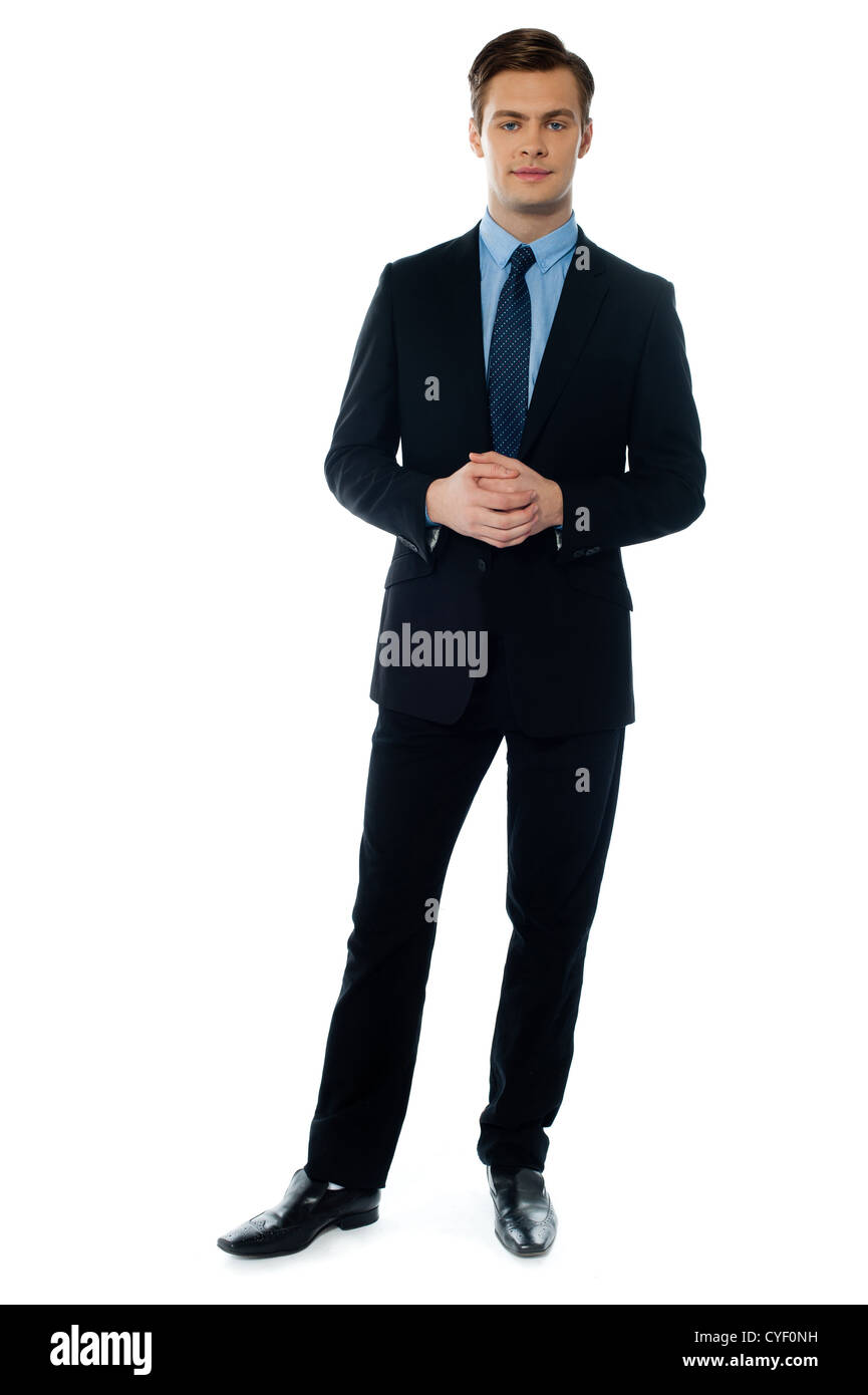 Handsome businessman in black suit posing against white background ...
