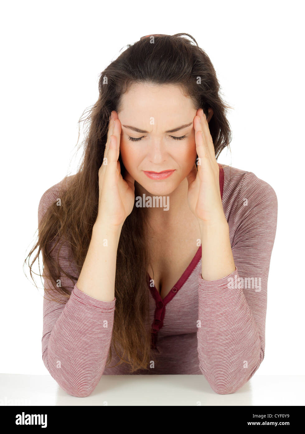 A beautiful young woman suffering from a bad head ache or migraine ...