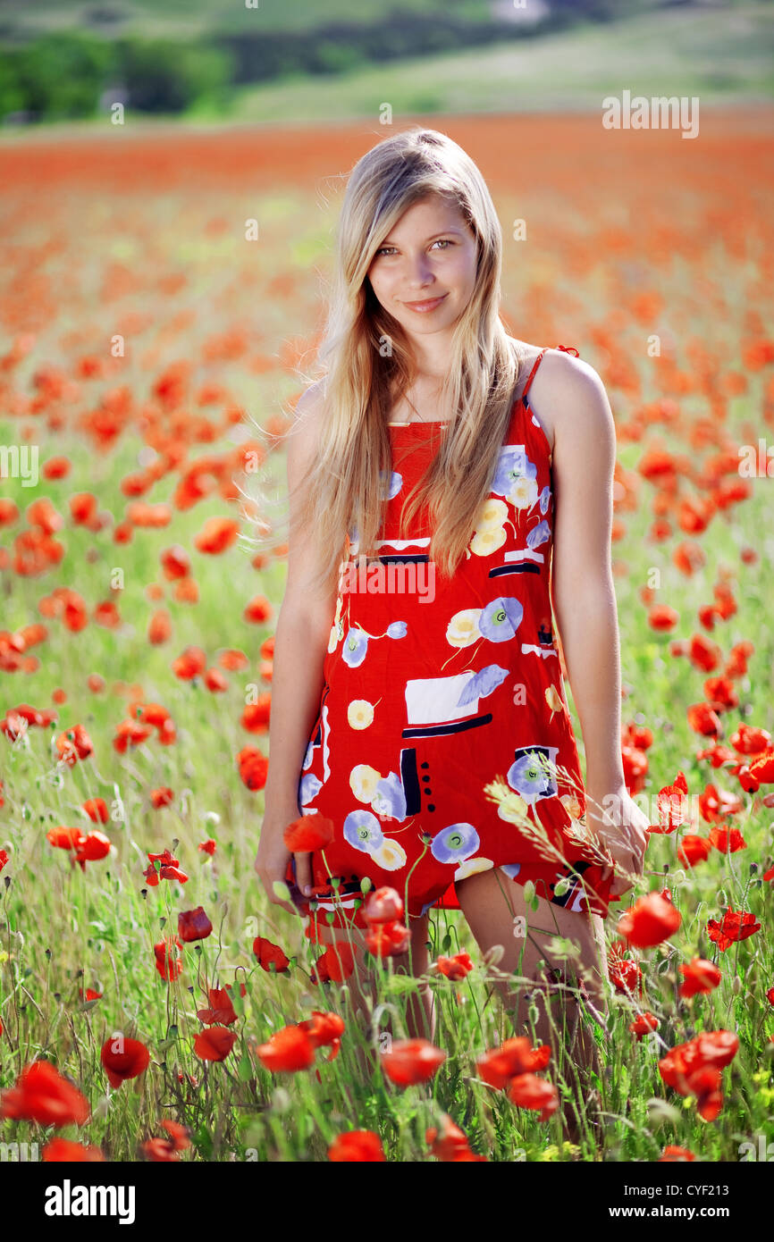 Girl in poppy field Stock Photo - Alamy