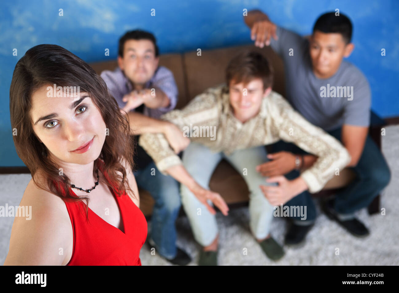 Three men try to reach out for a beautiful young woman Stock Photo - Alamy