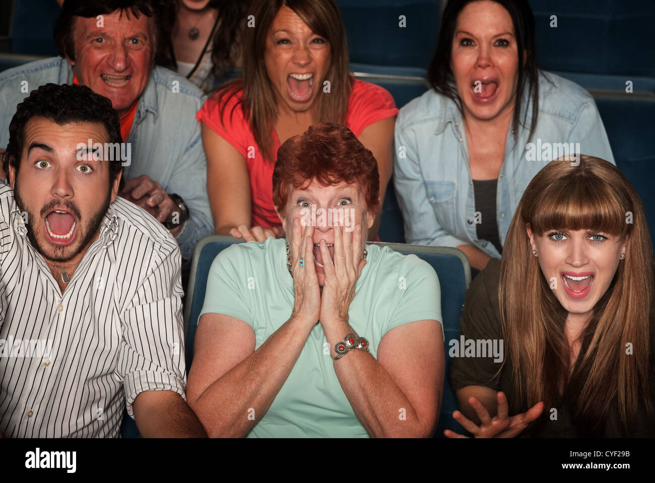 Shocked group of 7 people in theater Stock Photo - Alamy
