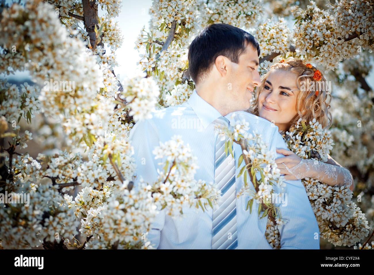 Kissing wedding couple in spring nature close-up portrait Stock Photo ...