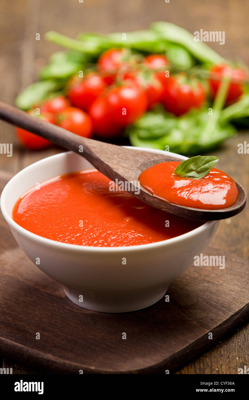 fresh red tomato sauce with basil leaf and wooden spoon Stock Photo - Alamy