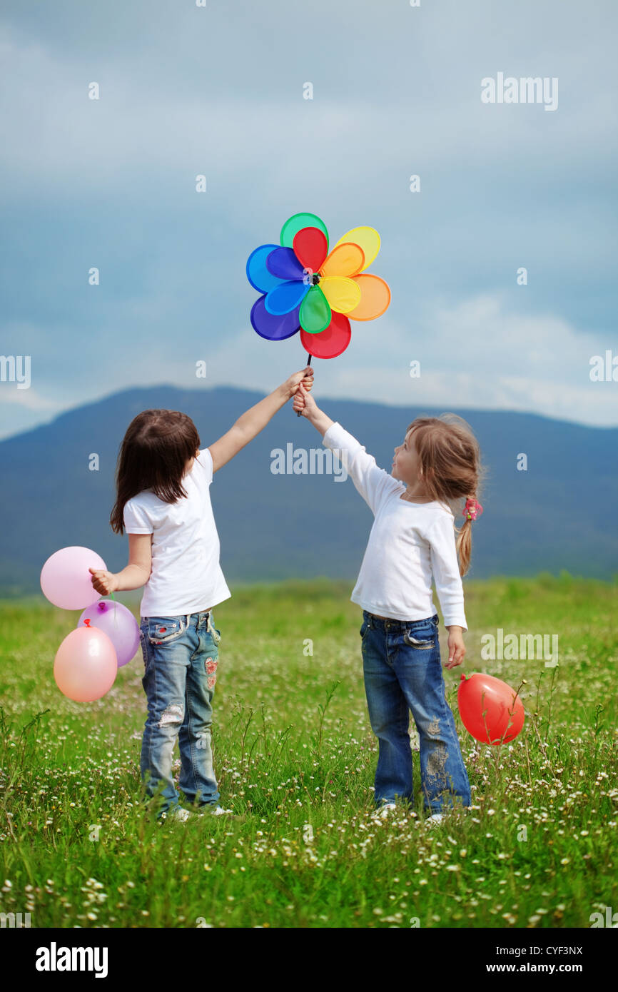 Children playing outdoors balloons hi-res stock photography and images ...