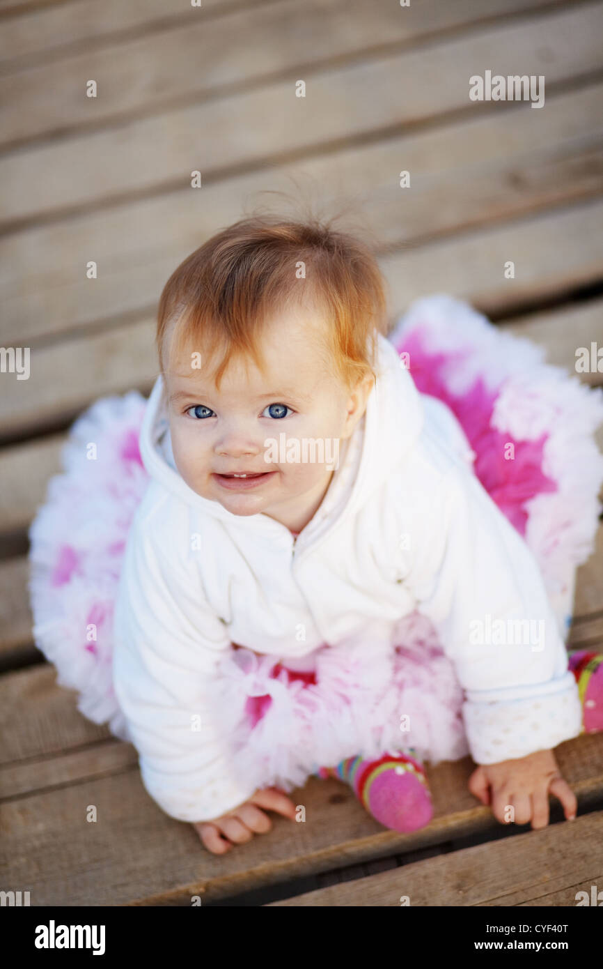 Adorable baby on wooden bridge Stock Photo - Alamy