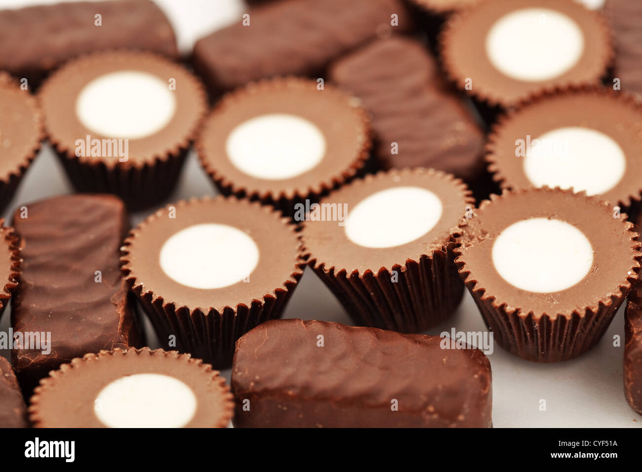 Milk and white chocolate pralines Stock Photo - Alamy