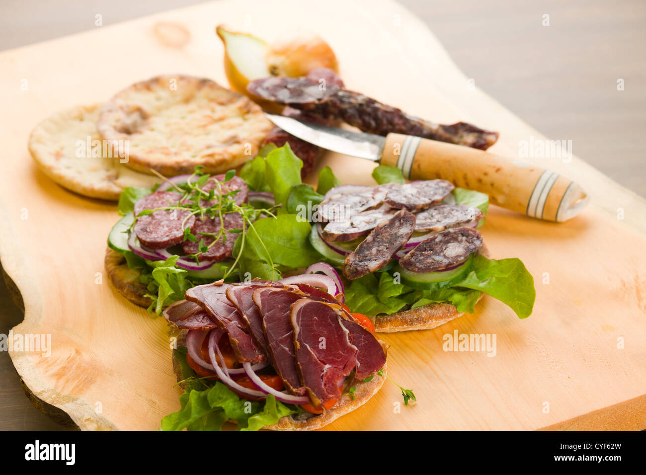 Reindeer meat appetizers on the chopping board, horizon shot Stock ...