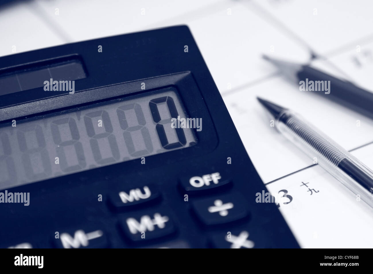 Financial calculation on table Stock Photo - Alamy