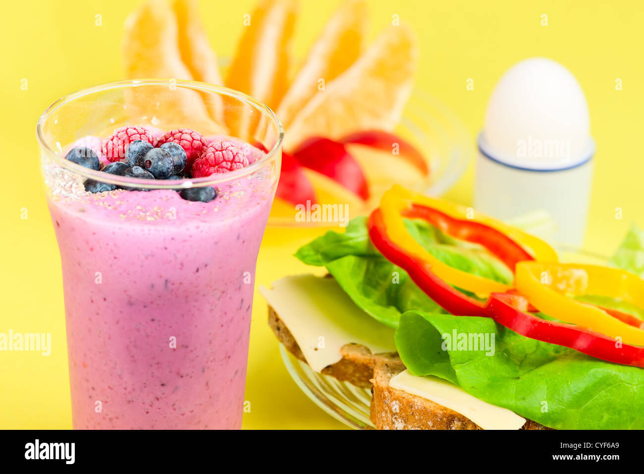 Healthy breakfast, yellow background and focus on berries Stock Photo ...