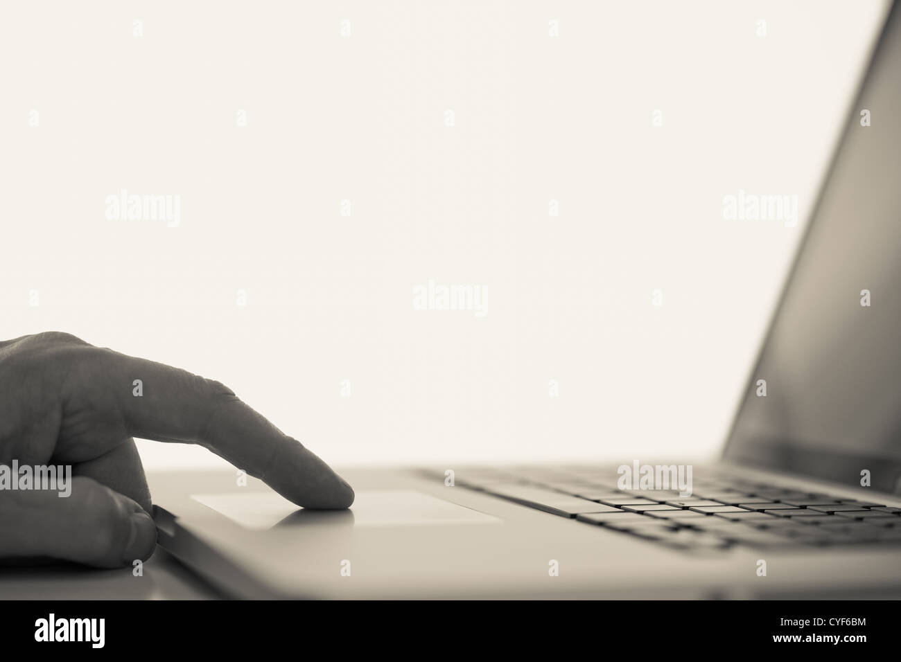 Man and computer, finger touching a touchpad Stock Photo - Alamy