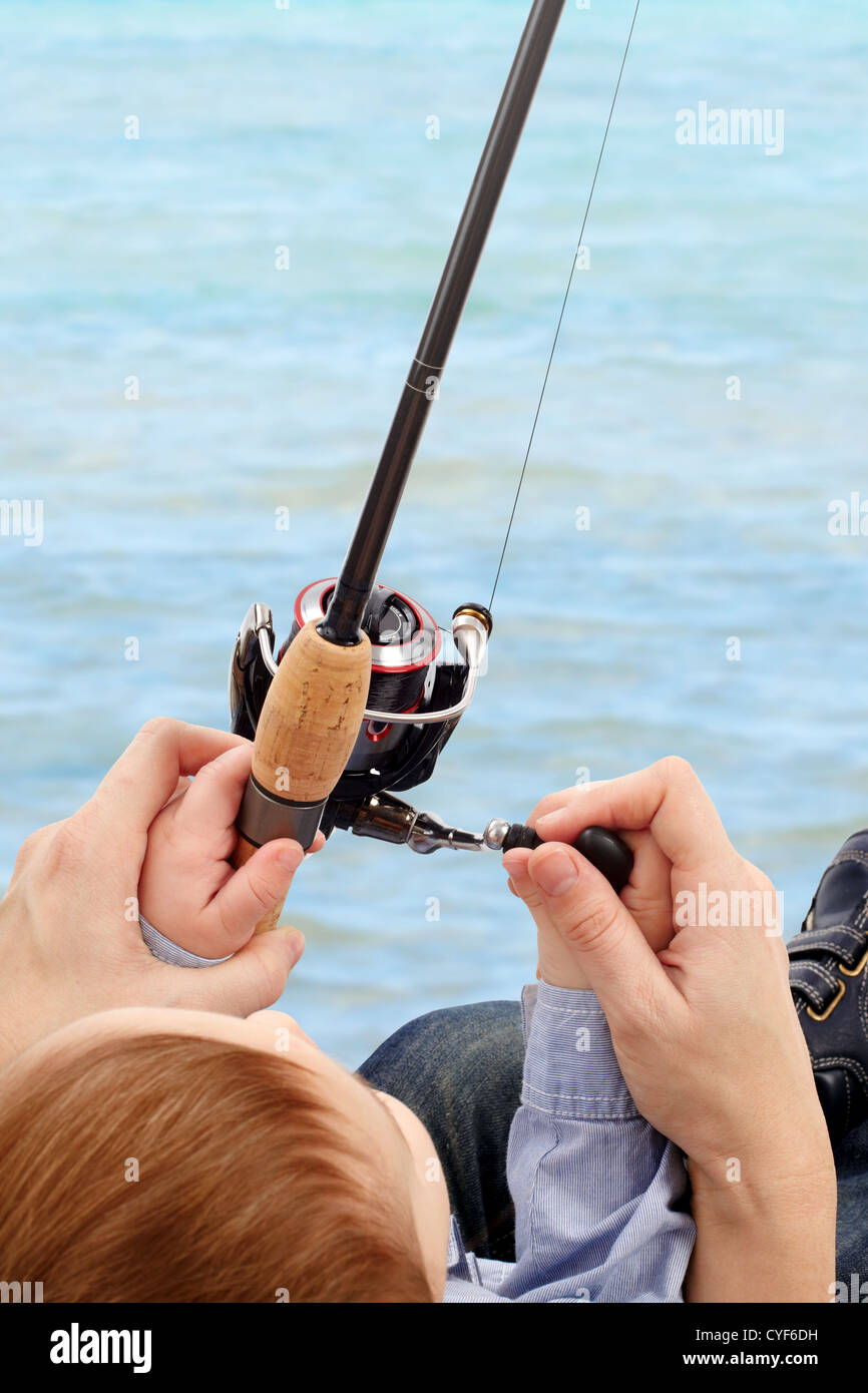 Teaching children how to fish hi-res stock photography and images - Alamy