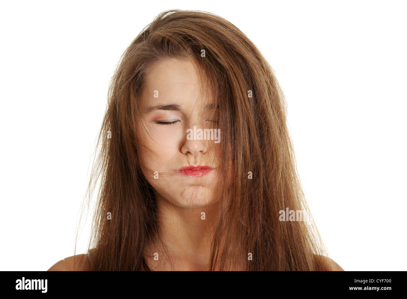 Front view face closeup of a young female teen making a face to the ...
