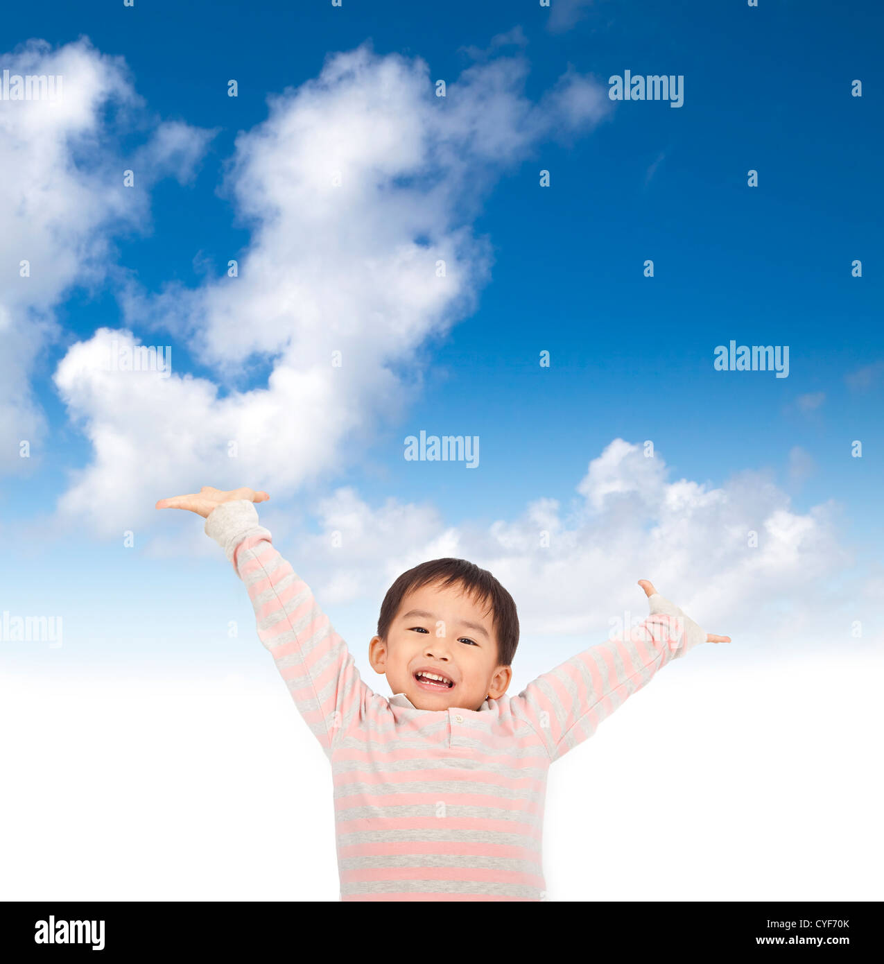 asian kid raising hands with sky background Stock Photo - Alamy