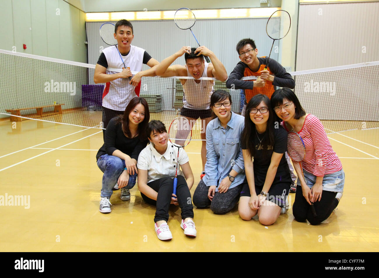 Asian friends playing badminton Stock Photo - Alamy
