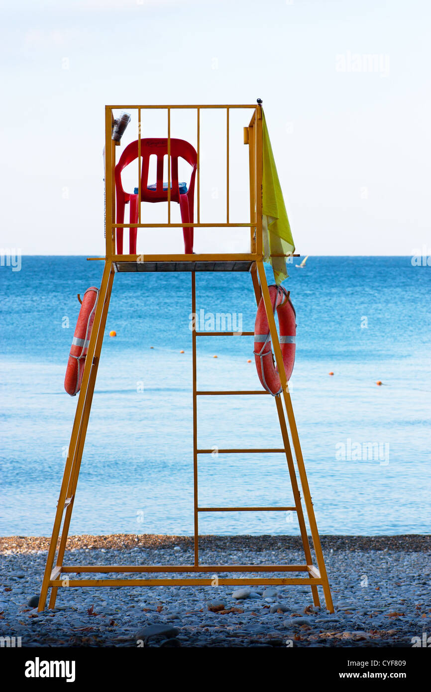 Empty lifeguard chair on the beach with life buoys Stock Photo - Alamy